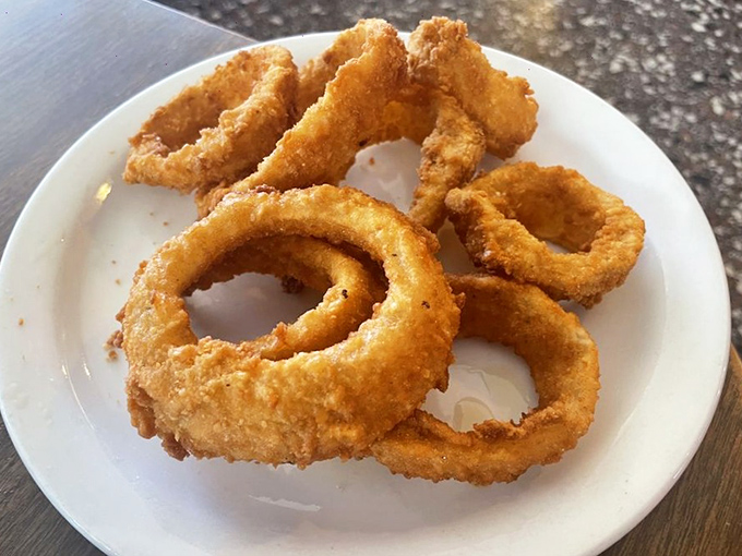 The perfect onion ring doesn't apologize for being simple&mdash;it celebrates the humble onion by wrapping it in a golden crust that shatters with each blissful bite.