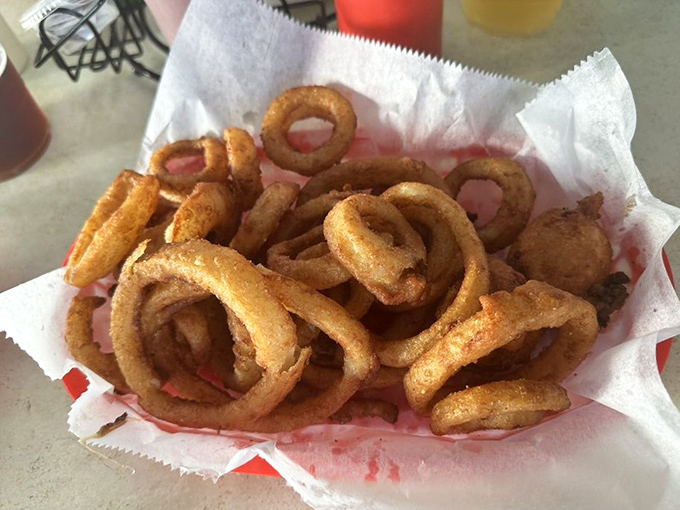 Golden halos of happiness. These onion rings aren't just sides&mdash;they're crispy, addictive main attractions in their own right.
