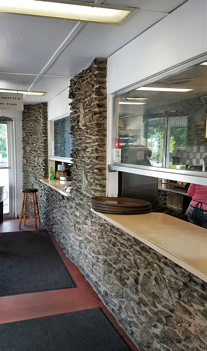 Stone walls frame the order counter like a rustic portal to comfort food nirvana. This isn't just a restaurant&mdash;it's a tenderloin temple with history in every crevice.