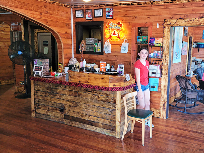 The rustic wooden counter welcomes you like an old friend. No formality here, just the promise of seafood treasures.