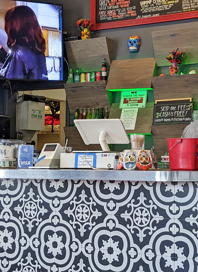 Colorful sugar skulls watch over the register, guardians of flavor in this temple of Mexican cuisine.