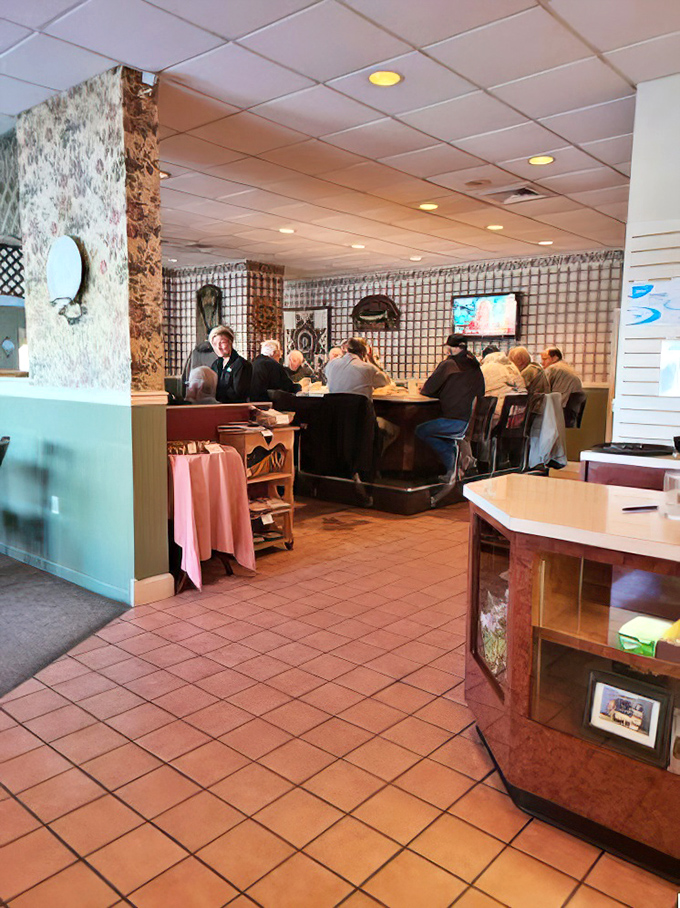 Classic diner seating where countless locals have solved world problems over coffee and pie since who knows when.