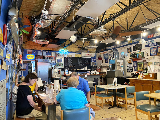 Simple tables, blue walls, and enough nautical d&eacute;cor to outfit a small navy. This is where seafood dreams come true without any fancy pretense.