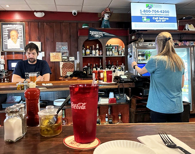 The warm wooden bar stretches invitingly through the tavern, a runway for plates of comfort food heading to their grateful destinations.