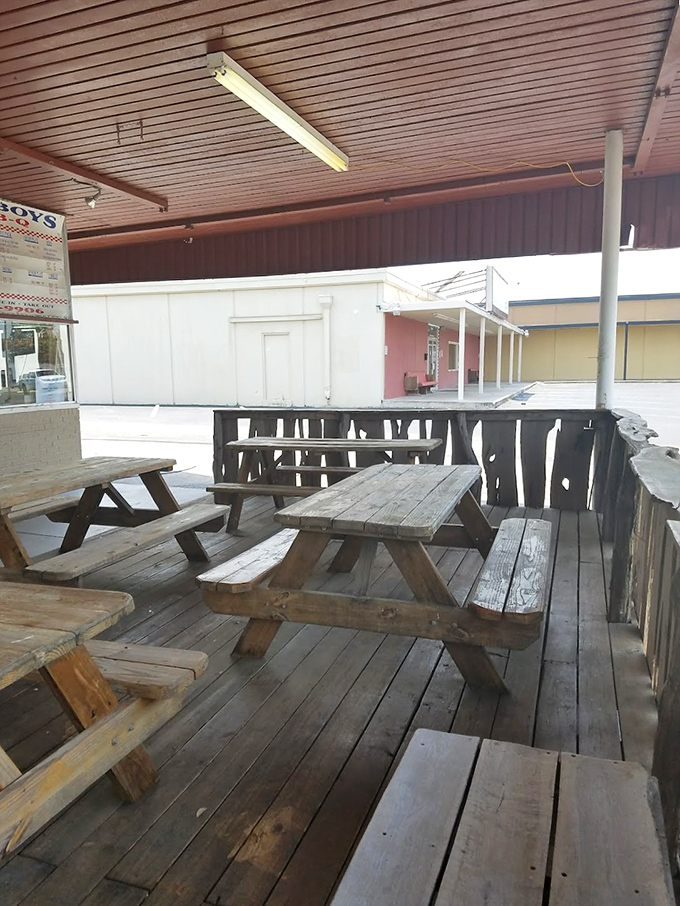 Weathered picnic tables tell stories of countless barbecue pilgrimages. Wood seasoned by time and Texas weather&mdash;just like the meat inside.