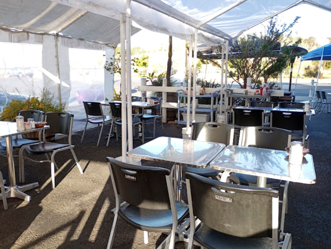 The outdoor dining area offers a sun-drenched alternative for those who prefer their hash browns with a side of vitamin D.