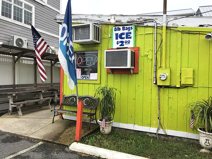 Even the outdoor seating area embraces the no-frills philosophy. The American flag and "OPEN" banner say all you need to know: come hungry, leave happy.