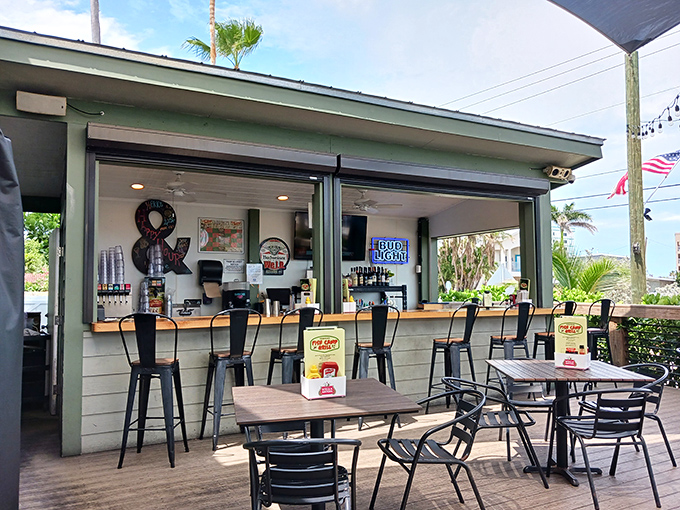 The outdoor bar area&mdash;where salt air enhances every sip and you're never more than a glance away from spotting a dolphin or a NASA engineer.