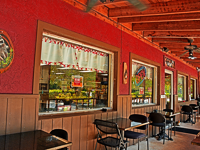 The outdoor seating area's vibrant red walls offer a splash of color almost as bold as the flavors waiting inside.