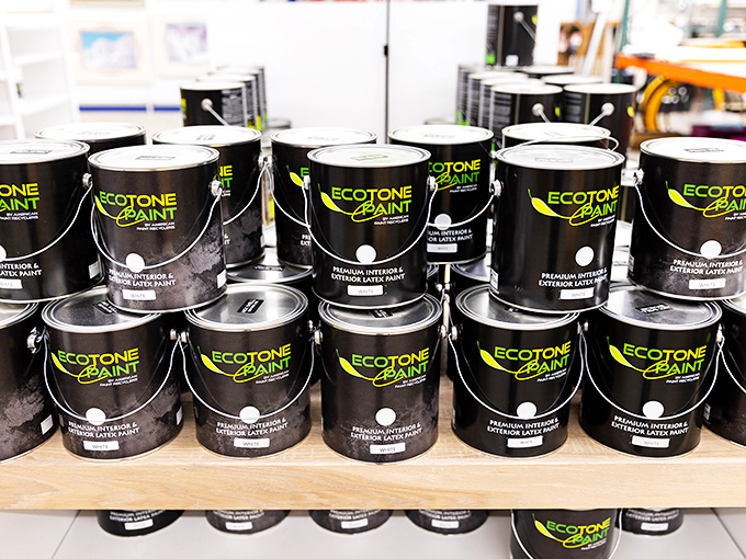 Paint cans standing at attention, each one a potential room makeover waiting to happen for fraction of retail.