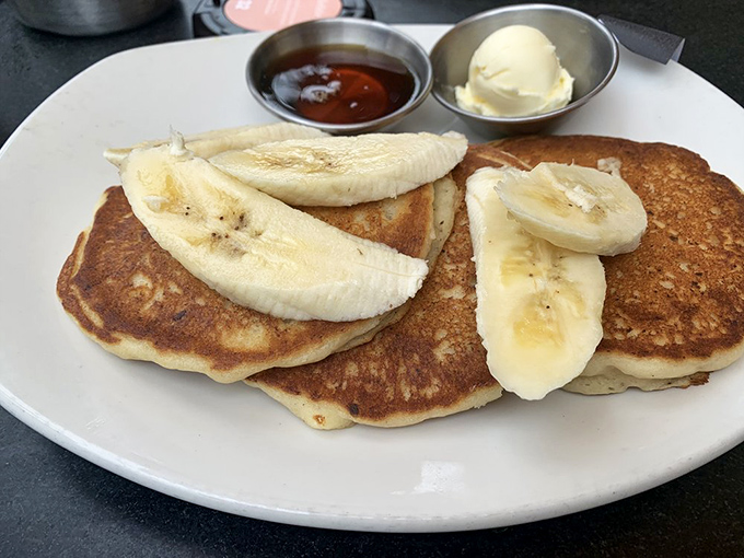 These pancakes with bananas aren't just breakfast – they're the reason some people get out of bed in the morning. Note the perfect golden-brown color.