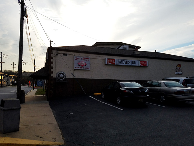 The parking lot view reveals Earl's other identity&mdash;"Sandwich Deli"&mdash;because one name isn't enough for a place this good.