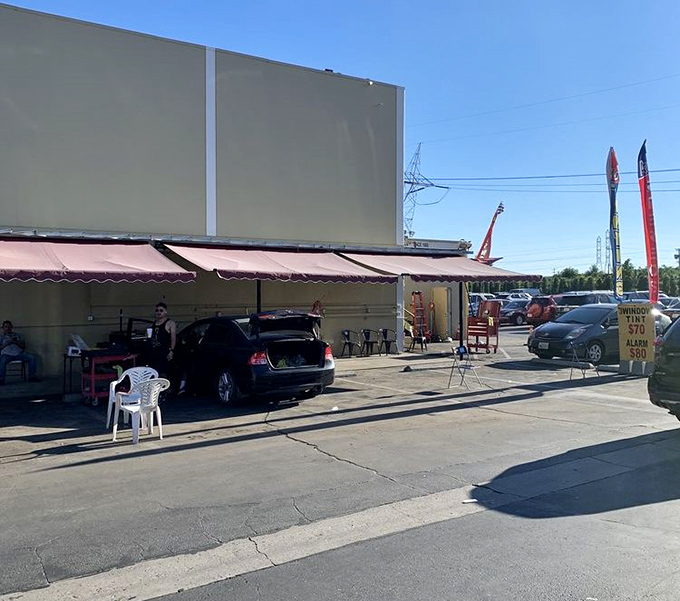 The outdoor hustle extends beyond the main building. Even the parking lot becomes retail space when bargain fever takes hold.