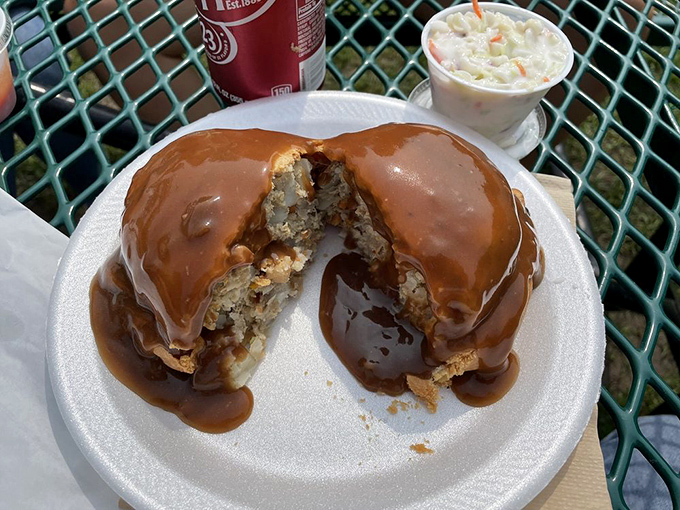 Gravy enthusiasts, rejoice! This pasty swimming in rich brown gravy with a side of coleslaw represents the ultimate U.P. indulgence. Diet starts tomorrow.