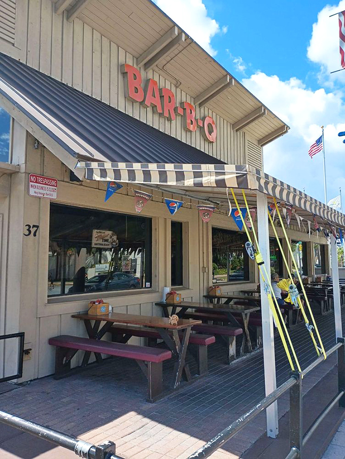 Outdoor seating where the ocean breeze mingles with barbecue smoke&mdash;a uniquely Daytona Beach dining experience worth writing postcards about.