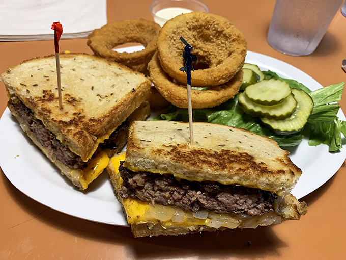 The patty melt &ndash; that glorious hybrid of burger and grilled cheese &ndash; flanked by golden onion rings that deserve their own fan club.