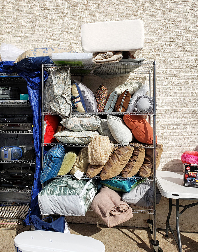 Pillow mountain! Enough cushions to build the fort your inner child still dreams about, in every color imaginable.
