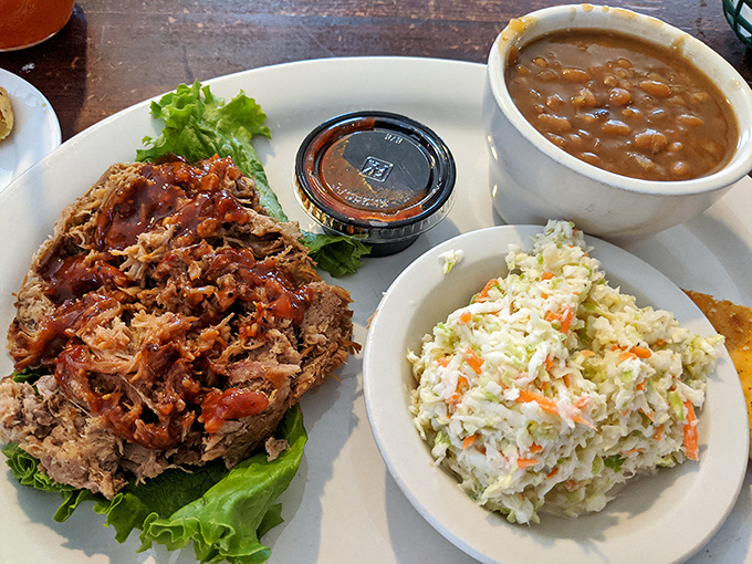 Pulled pork that doesn't need fancy presentation because it's too busy being delicious. That slaw isn't a side&mdash;it's the perfect dance partner.