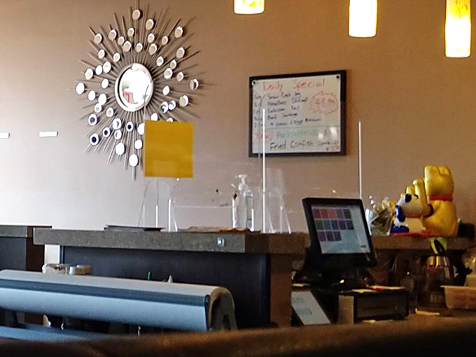 That sunburst mirror watches over the daily specials board—even the décor seems excited about what's cooking in the kitchen.