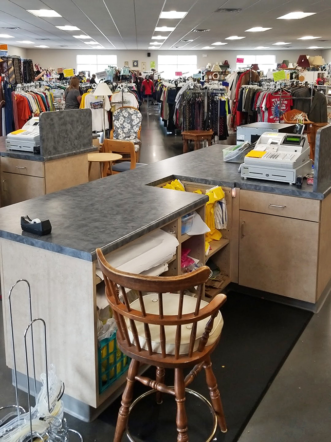 Command central, where volunteers ring up bargains with a smile. The wooden captain's chair adds a touch of nautical authority to the proceedings.