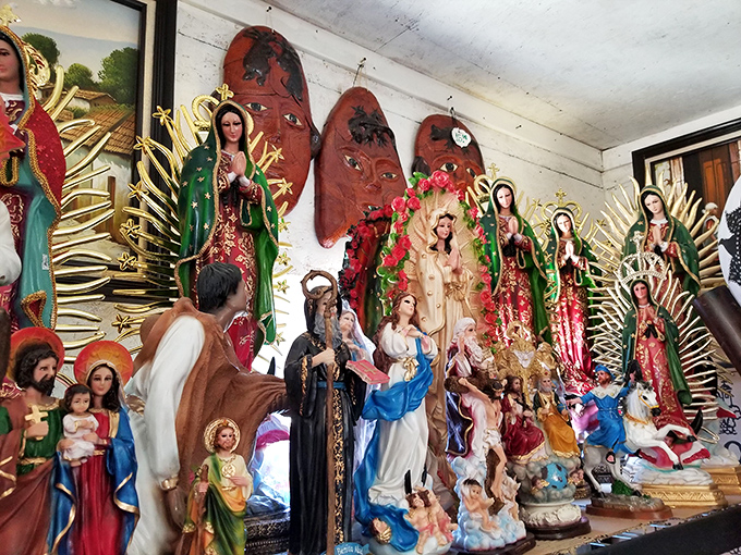 A shrine to devotion and craftsmanship. This collection of religious figurines represents both spiritual significance and artistic tradition.