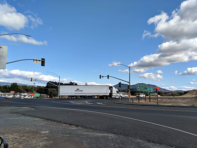 Open roads lead to mountain vistas, where traffic jams are when a truck and two cars meet at an intersection.