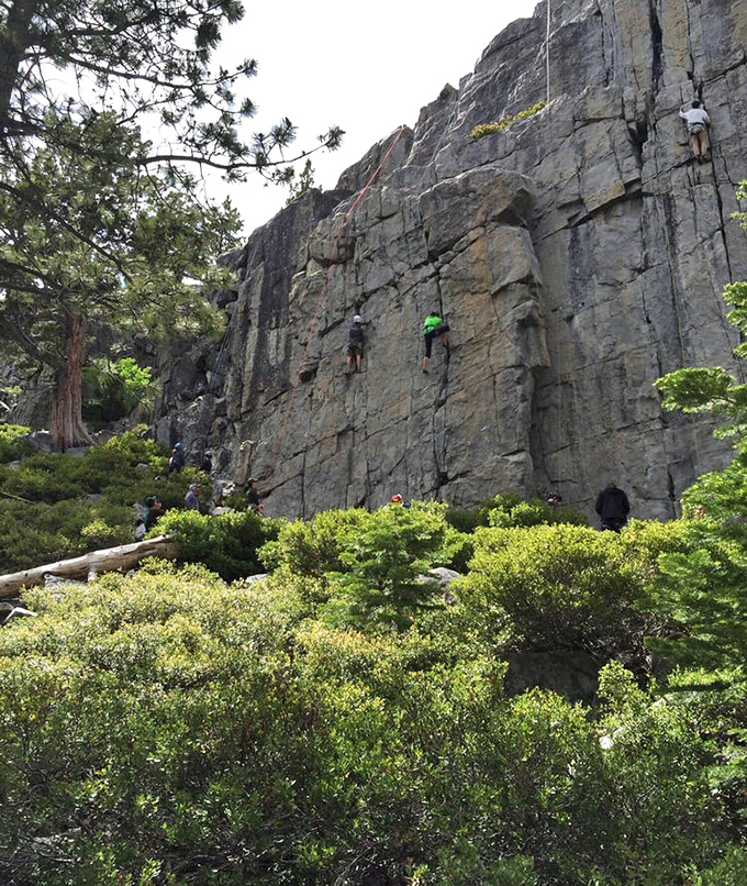 Rock climbers treating granite cliffs like their personal jungle gym while the rest of us watch in awe.