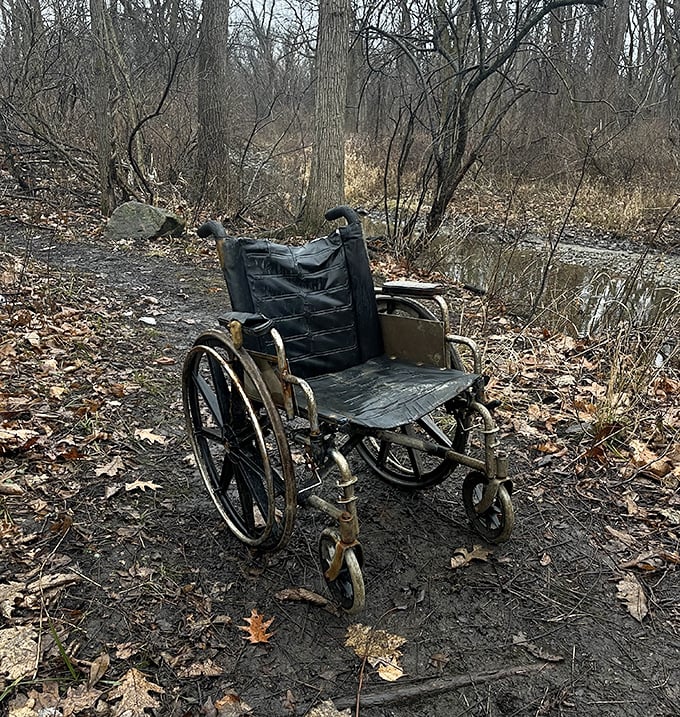 An abandoned wheelchair on the path creates an unsettling tableau. Stephen King couldn't have staged a more perfect prop for maximum goosebumps.