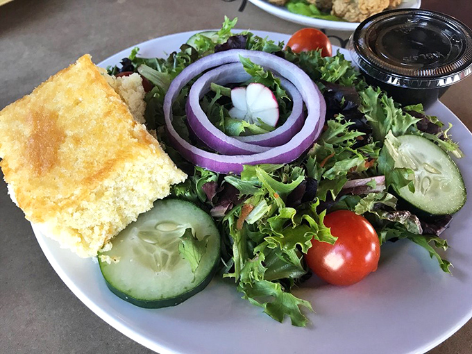 Even the salad looks happy to be here. That cornbread square is the supporting actor who steals every scene.