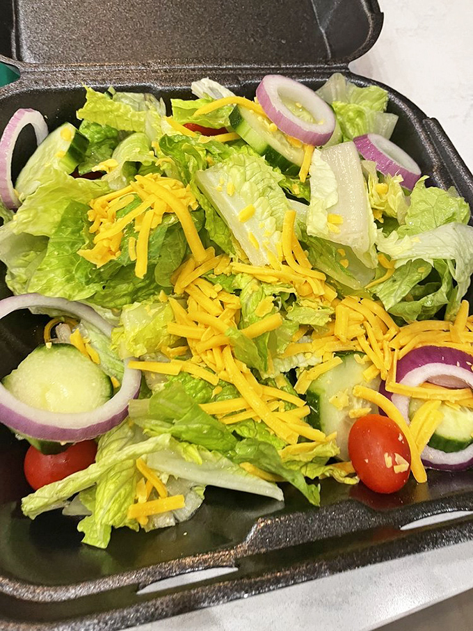 Even the salad gets the Texas treatment—a rainbow of fresh vegetables and cheese that doesn't apologize for being the lighter option.