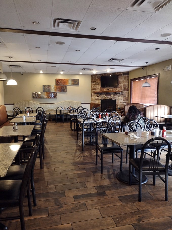 Modern meets classic in this dining room &ndash; where stone fireplaces watch over breakfast conversations daily.