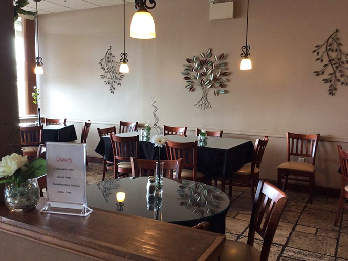 Elegant simplicity defines the dining room, where metal wall art and pendant lighting create an atmosphere that's both casual and special.