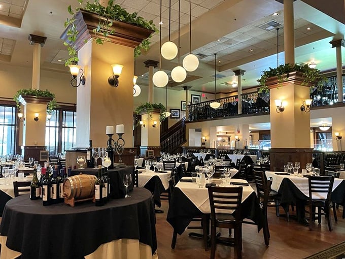 Dining room grandeur that makes Tuesday night spaghetti feel like a special occasion, with globe lights and greenery adding to the ambiance.