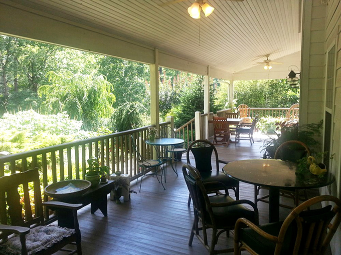 A porch made for lingering, where sandwiches taste better and conversations flow as easily as the gentle breeze through the surrounding trees.
