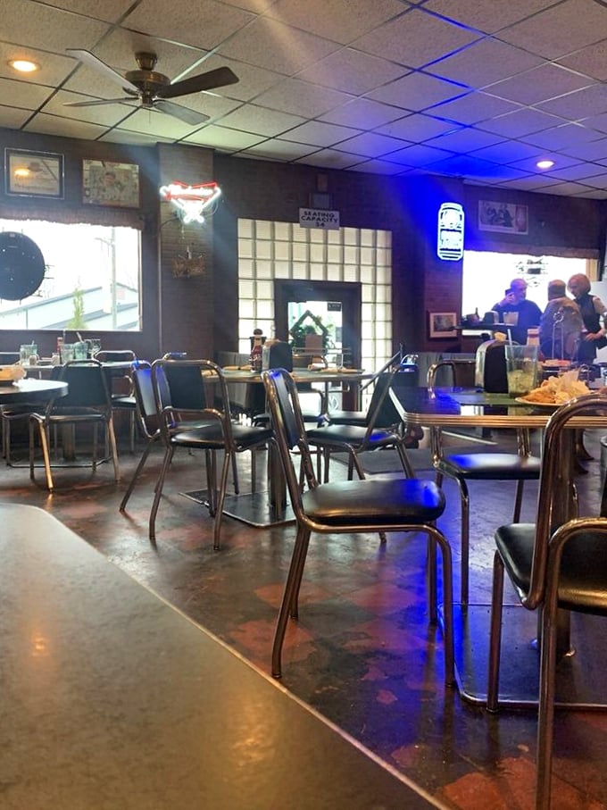 No-nonsense seating that says, "We put our energy into the food, not the furniture." The neon beer signs provide all the ambiance you need.