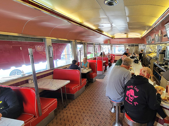 Red booths filled with locals sharing stories and laughter &ndash; this is where community happens, one meal at a time.
