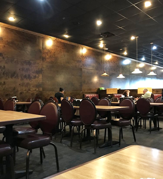 Comfortable seating with warm lighting creates the perfect backdrop for the main event &ndash; systematically trying everything on the buffet line.