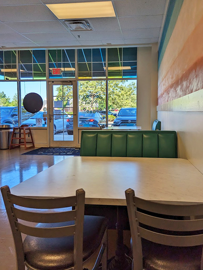 Simple seating with splashes of green offers the perfect stage for the main event: your imminent donut-induced moment of bliss.