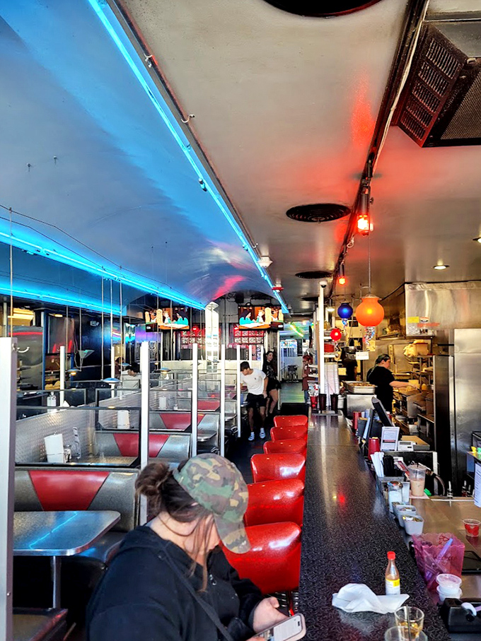 A glimpse down the narrow passage of culinary delight. Those red stools have heard thousands of "I shouldn't, but I will" dessert orders.