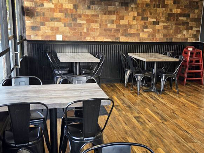 Minimalist design with maximum flavor potential. The metal chairs and wooden tables create an unpretentious stage for the upcoming feast.