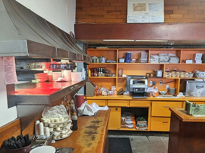 The kitchen's organized chaos&mdash;where magic happens without molecular gastronomy or tweezers. Just honest cooking with well-seasoned equipment.