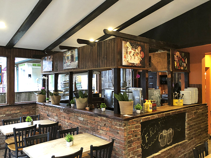 The heart of the operation &ndash; brick, wood, and the promise of good things to come from behind those kitchen doors.