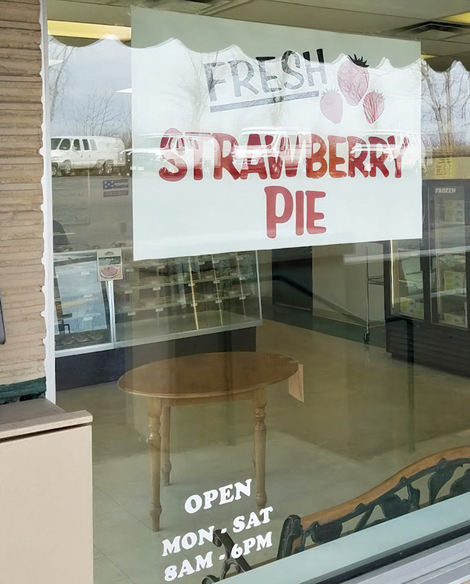 The "FRESH STRAWBERRY PIE" sign in the window is both an announcement and a gentle command to stop whatever you're doing.