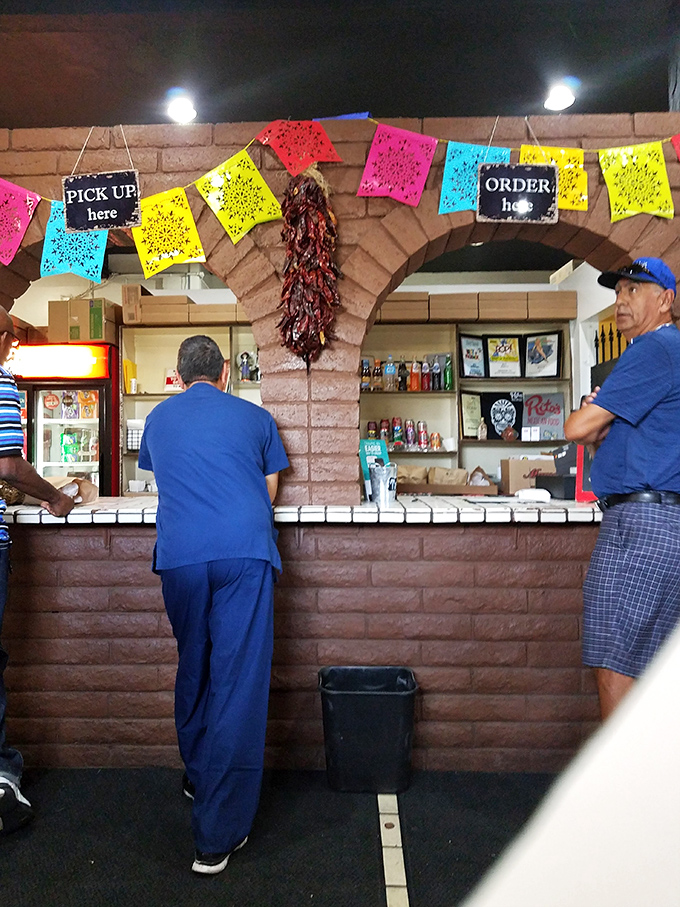 The ordering counter &ndash; where dreams begin and hunger ends. Those colorful papel picado banners are basically victory flags for your appetite.