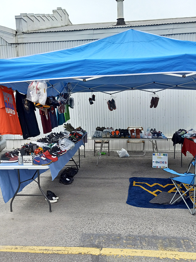 Footwear finds under the blue canopy. This vendor's shoe selection proves that sometimes the perfect pair comes with a story, not a box.