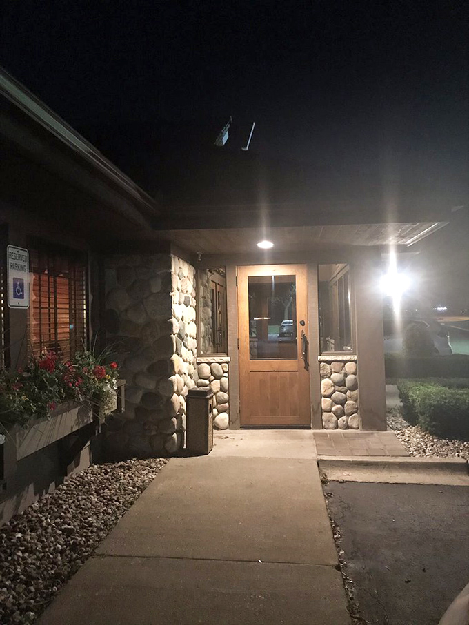 After sunset, the stone entrance glows with welcome&mdash;like a lighthouse guiding hungry travelers to safe harbor.