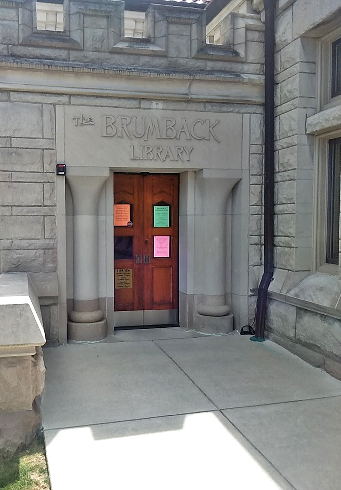 Even the side entrance maintains the castle aesthetic. This doorway has welcomed countless knowledge seekers into the stone fortress of books.