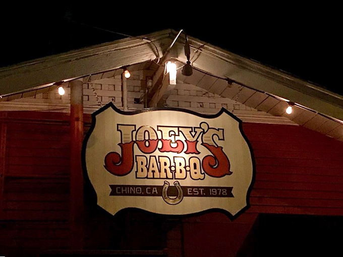 When darkness falls, the Joey's sign glows like a beacon for the barbecue faithful. Follow the light to smoked meat salvation in California.