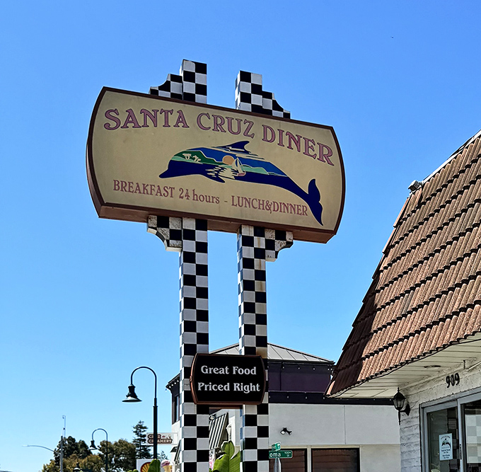 The checkered sign against blue California sky announces "Breakfast 24 Hours" &ndash; three words that feel like a warm embrace at any time of day.