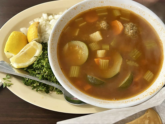 This isn't soup&mdash;it's a vegetable swimming pool with meatball lifeguards. The fresh cilantro and lemon are your flavor lifelines.